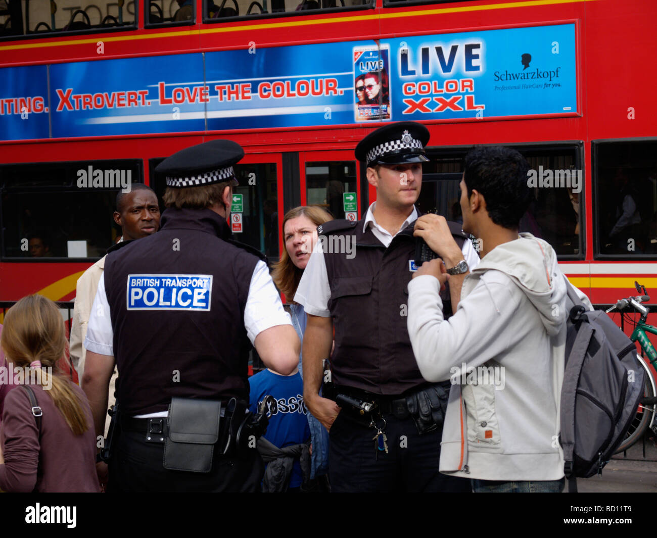 Officers of the British Transport Police answering questions from the ...