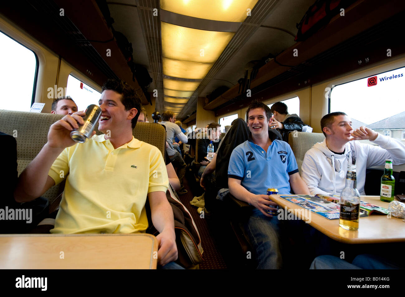 Young white European males celebrating on a train journey Stock Photo ...