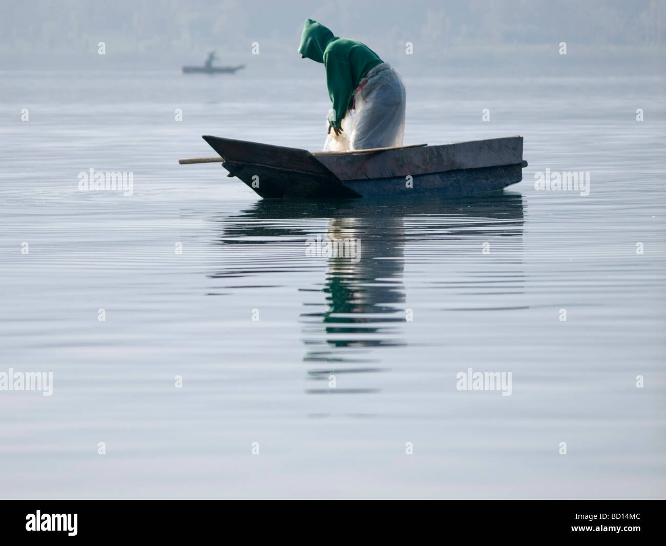 A fisherman at work on a Lake Stock Photo - Alamy