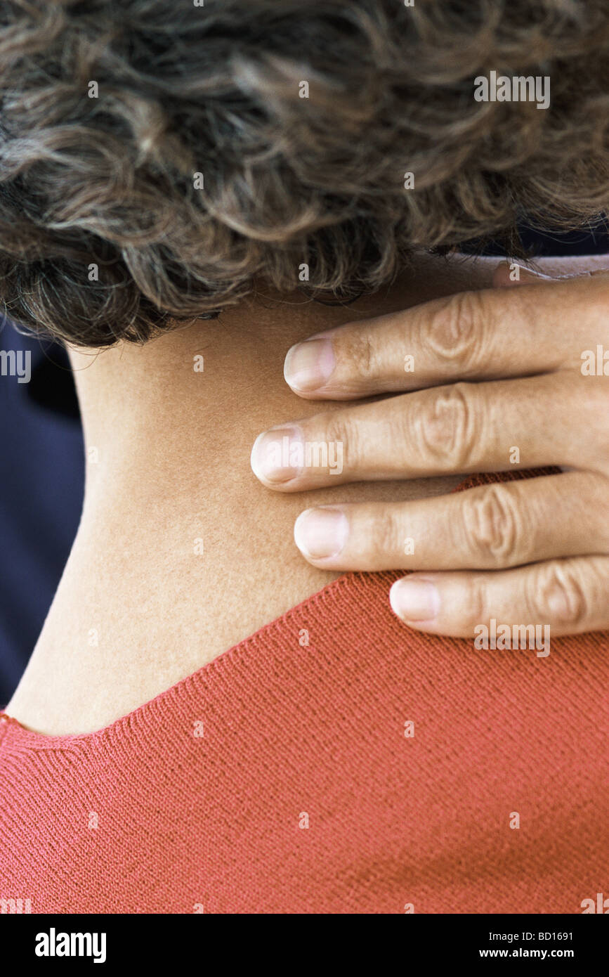 Man's hand on back of woman's neck, close-up Stock Photo - Alamy