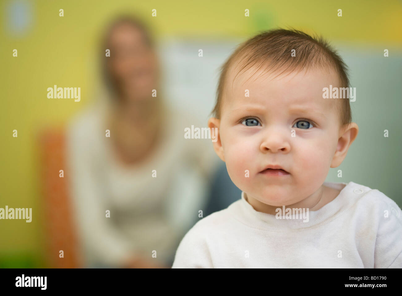 Baby, mother in background, portrait Stock Photo - Alamy