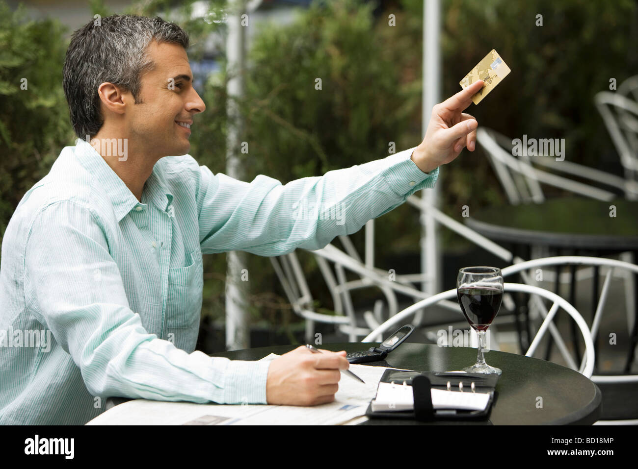Man sits cafe holding hi-res stock photography and images - Alamy