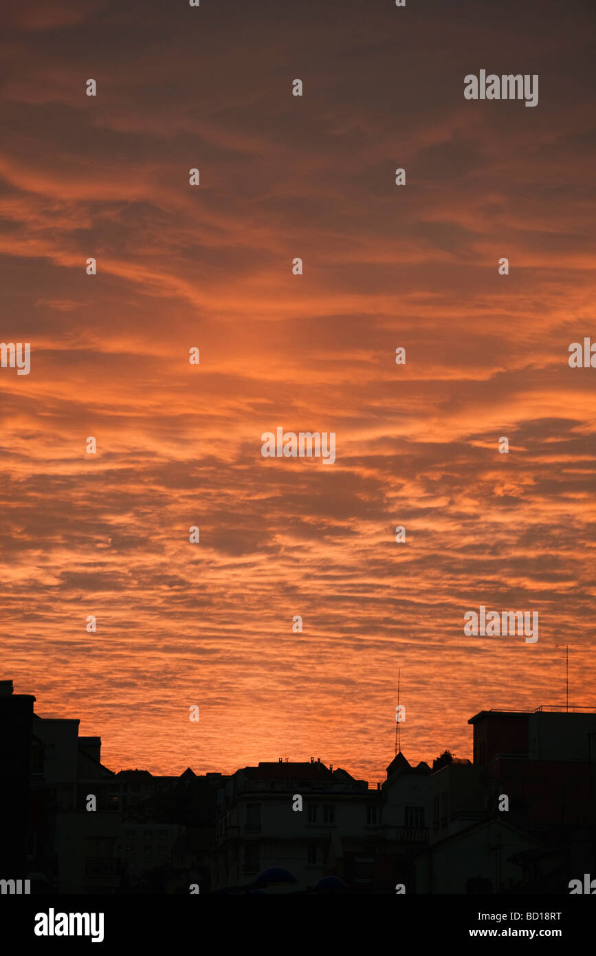 Sunset over rooftops Stock Photo - Alamy