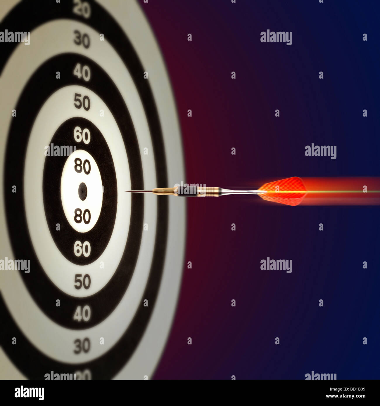 Dart reaching dartboard Stock Photo - Alamy