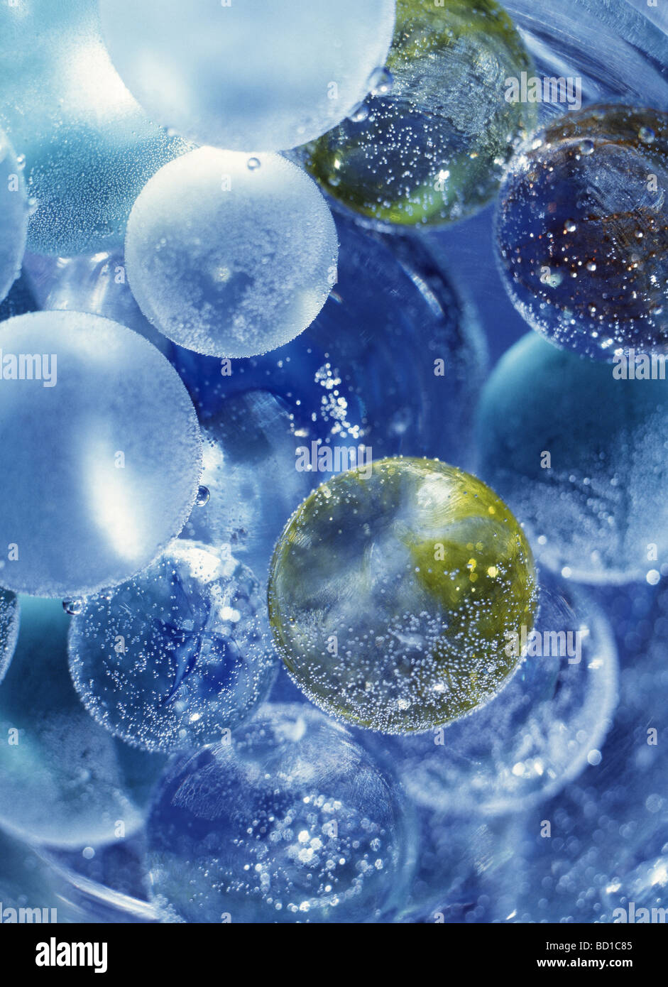 Marbles in water Stock Photo - Alamy