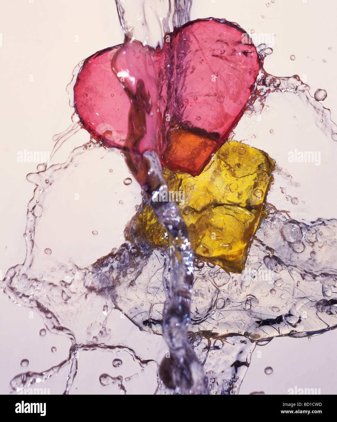 Heart shaped and square objects being washed Stock Photo - Alamy