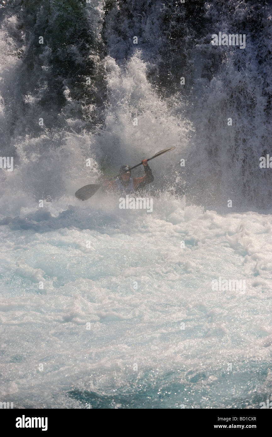 Man in a kayak just dropped down a waterfall Stock Photo - Alamy