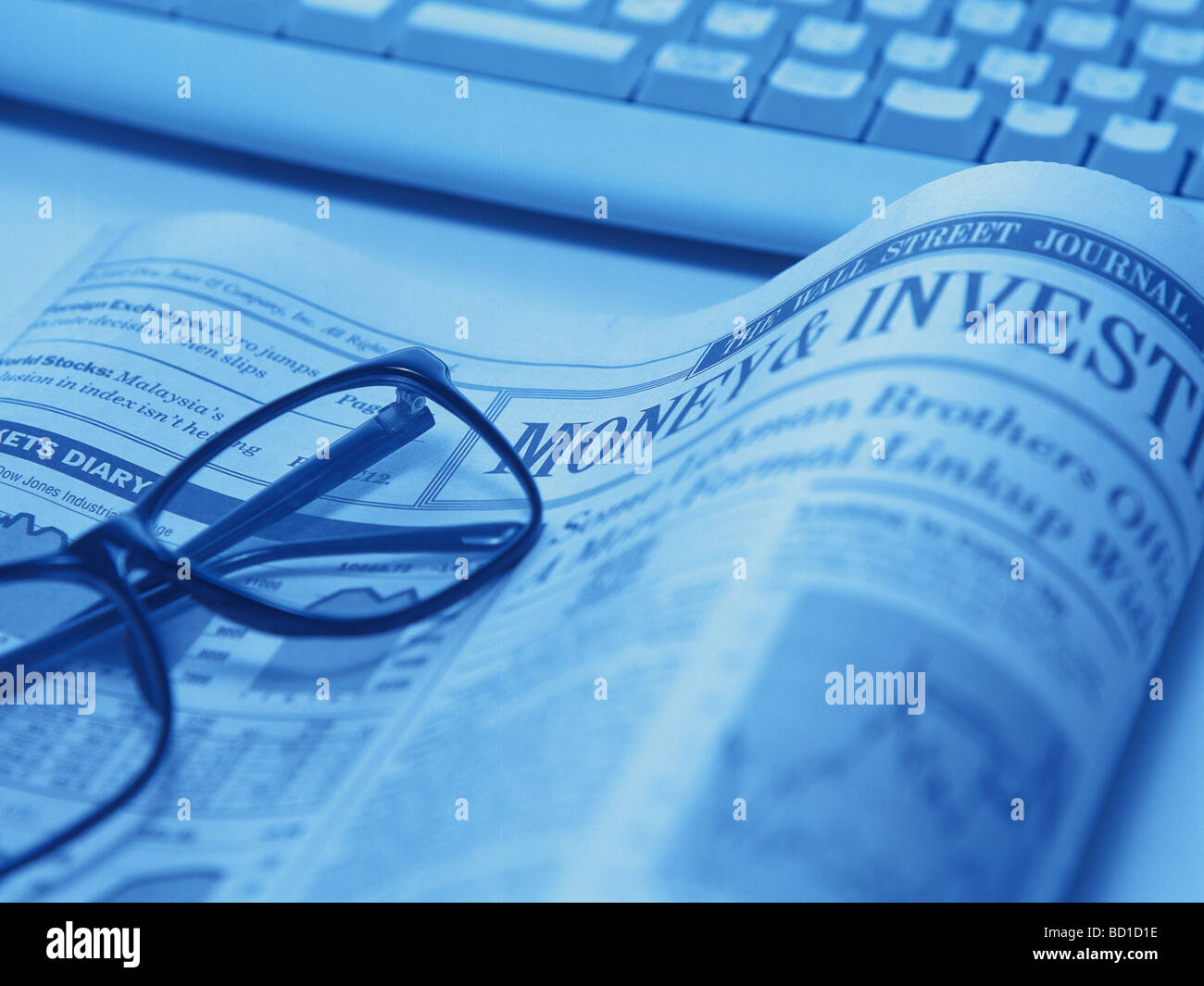 Eye glasses on newspaper Stock Photo - Alamy