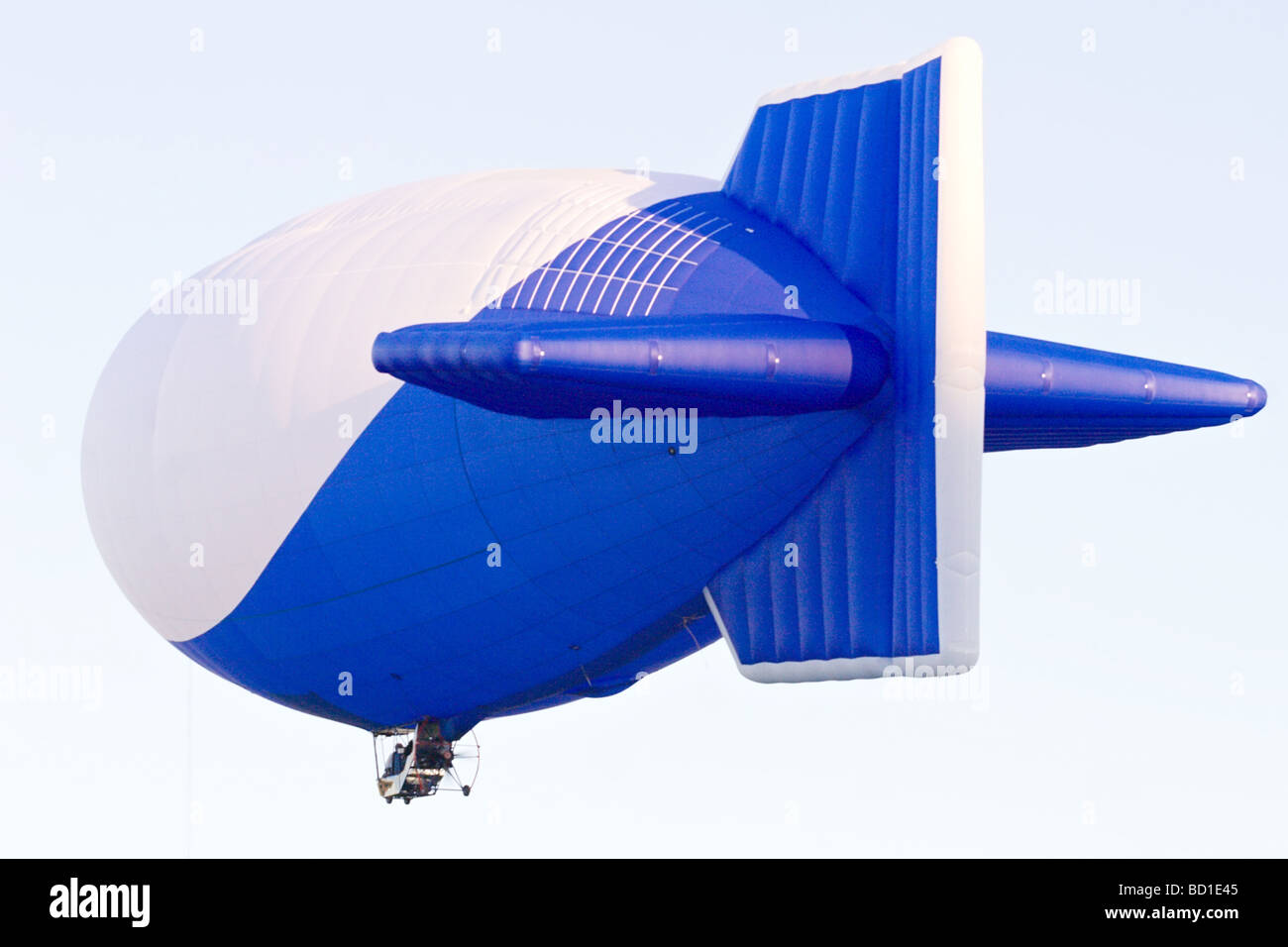 flying blimp on clear blue sky background Stock Photo - Alamy