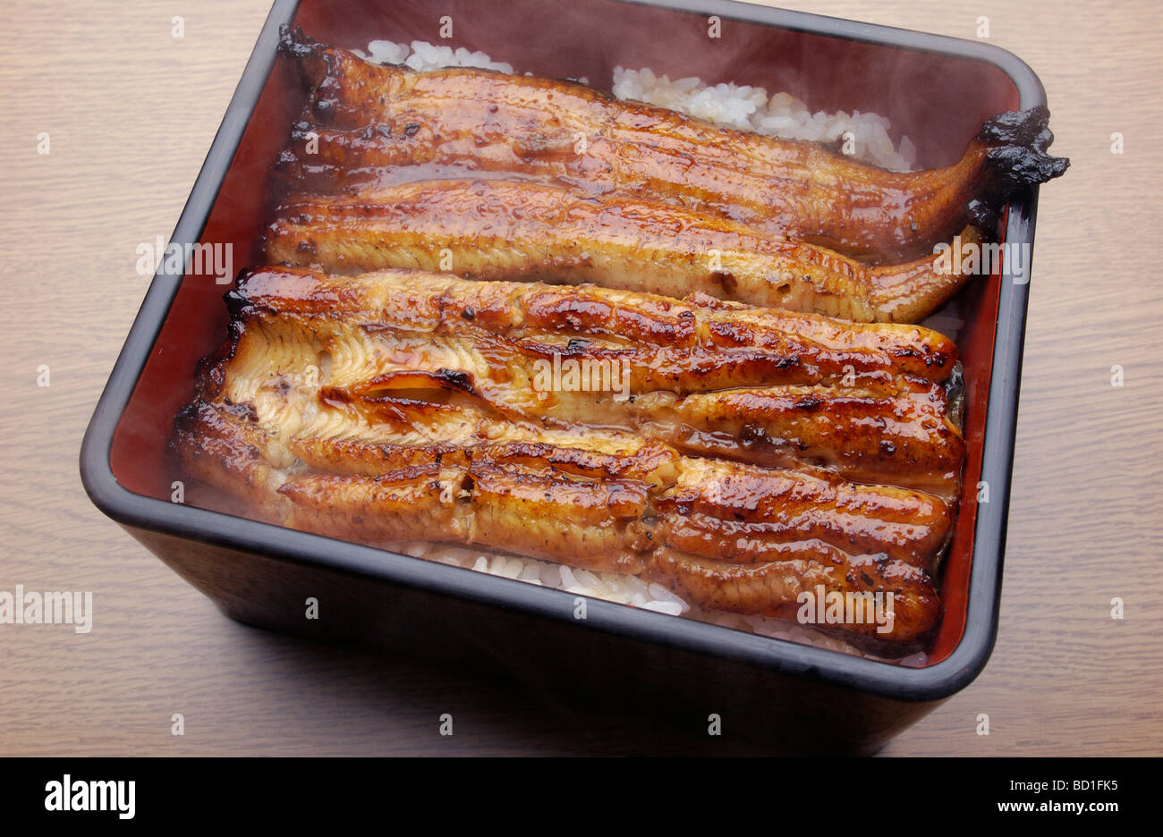Broiled eel on rice in box Stock Photo - Alamy
