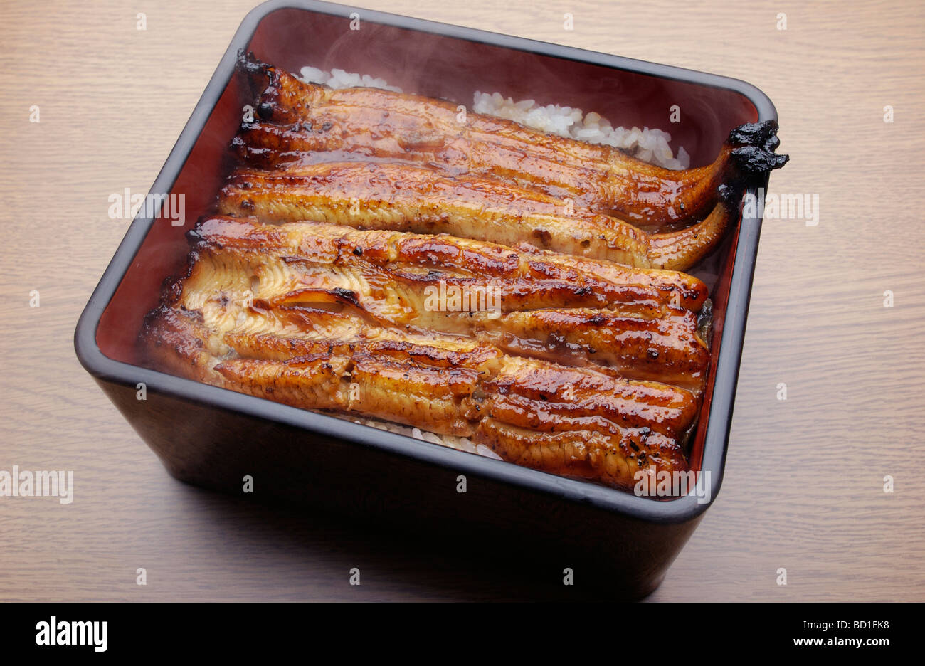 Broiled eel on rice in box Stock Photo - Alamy
