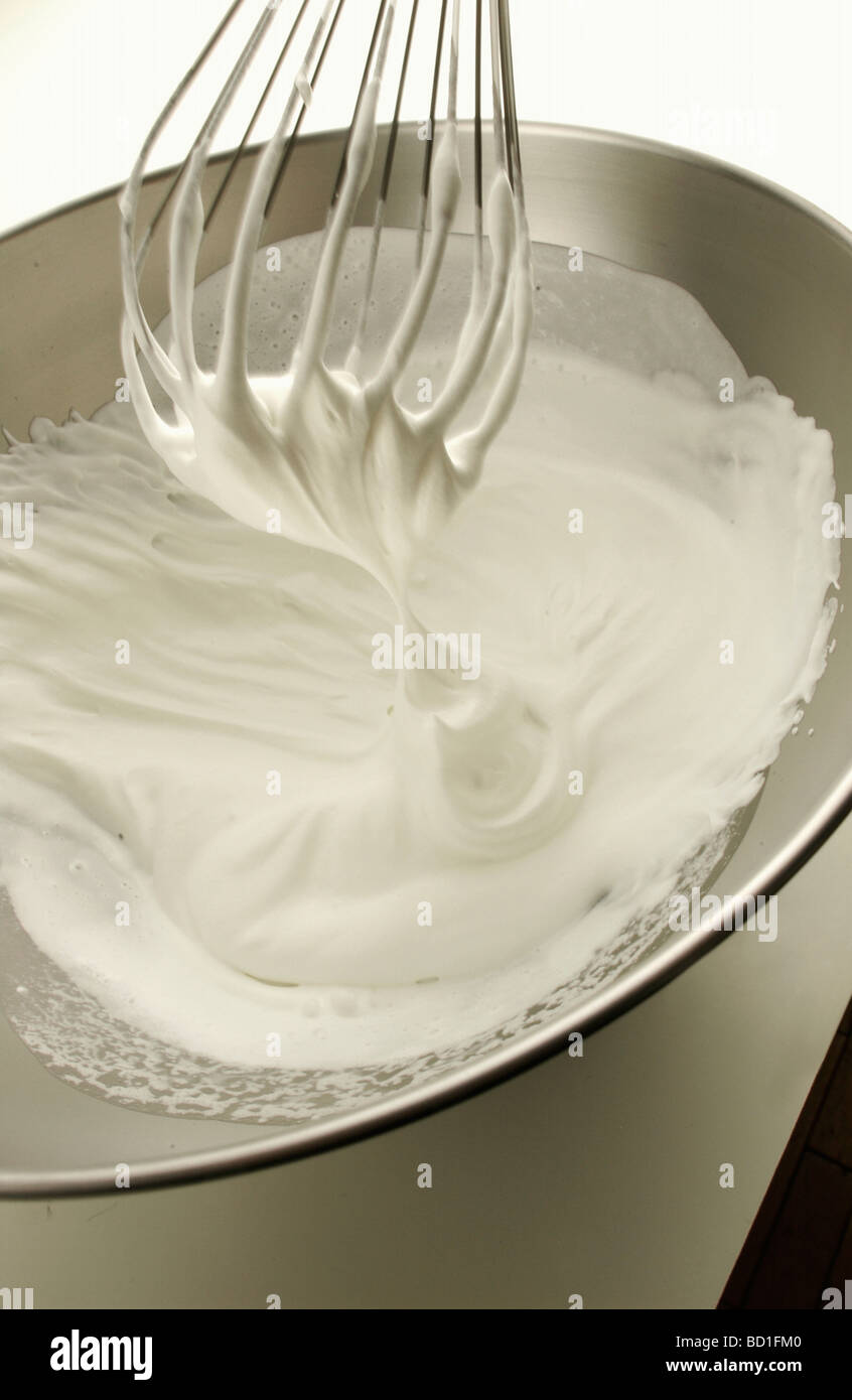 Whipped cream on whisk Stock Photo - Alamy