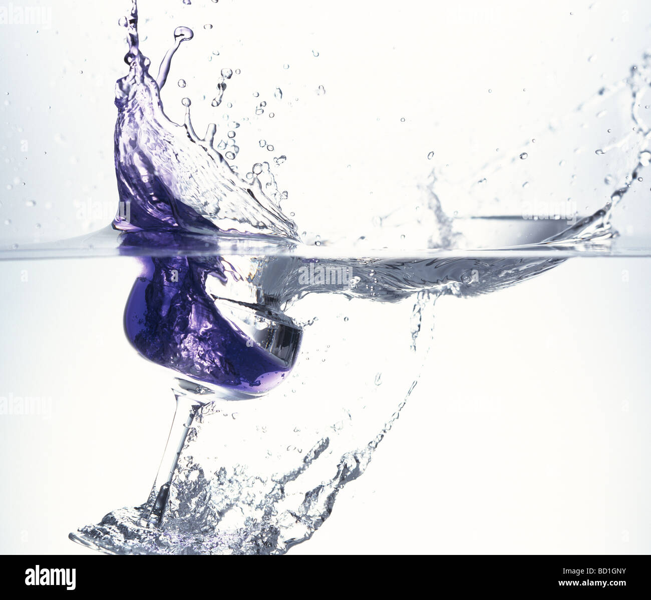 Glass dropped in water white background Stock Photo - Alamy