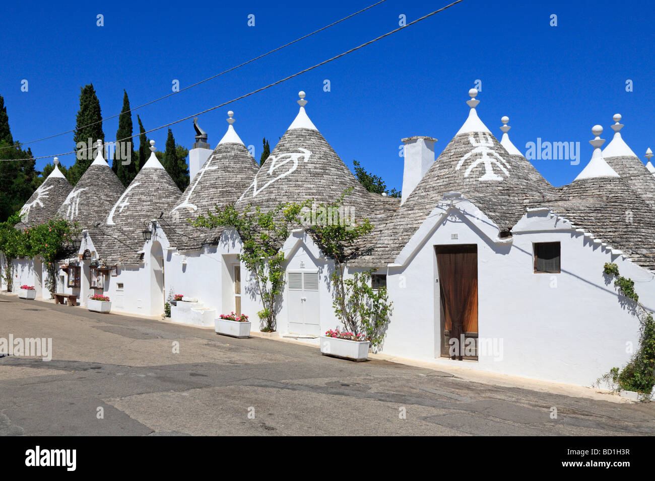 Painted symbols on trulli in Rione Monti, Alberobello, Trulli Village ...
