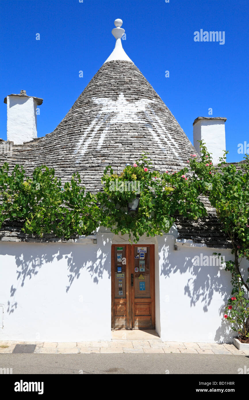 Painted symbol on trullo in Rione Monti, Alberobello, Trulli Village ...
