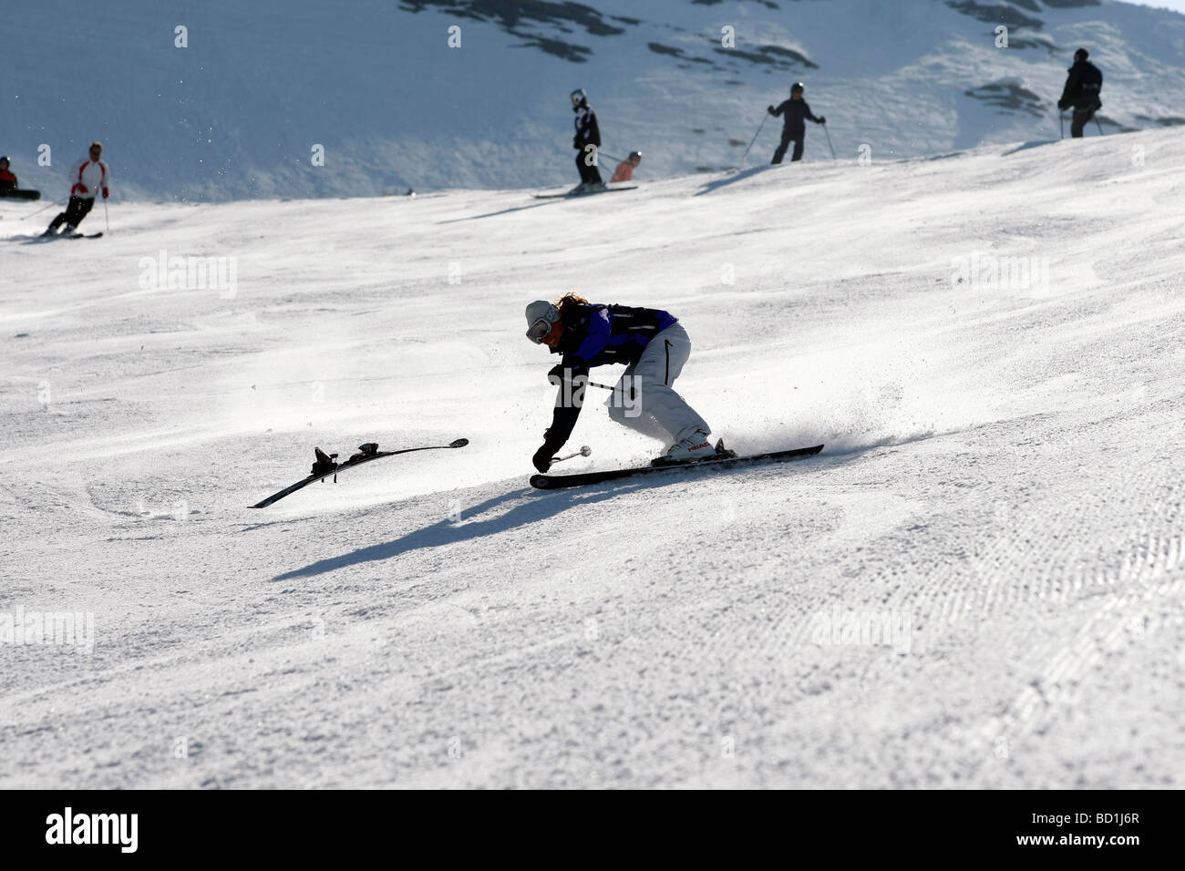 Skier falling down while going downhill in Austria Stock Photo - Alamy