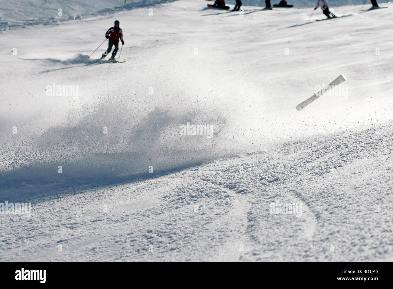 Skier falling down while going downhill in Austria Stock Photo - Alamy