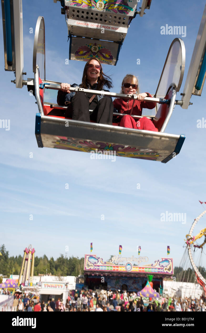 Woman ride fair fun hi-res stock photography and images - Alamy