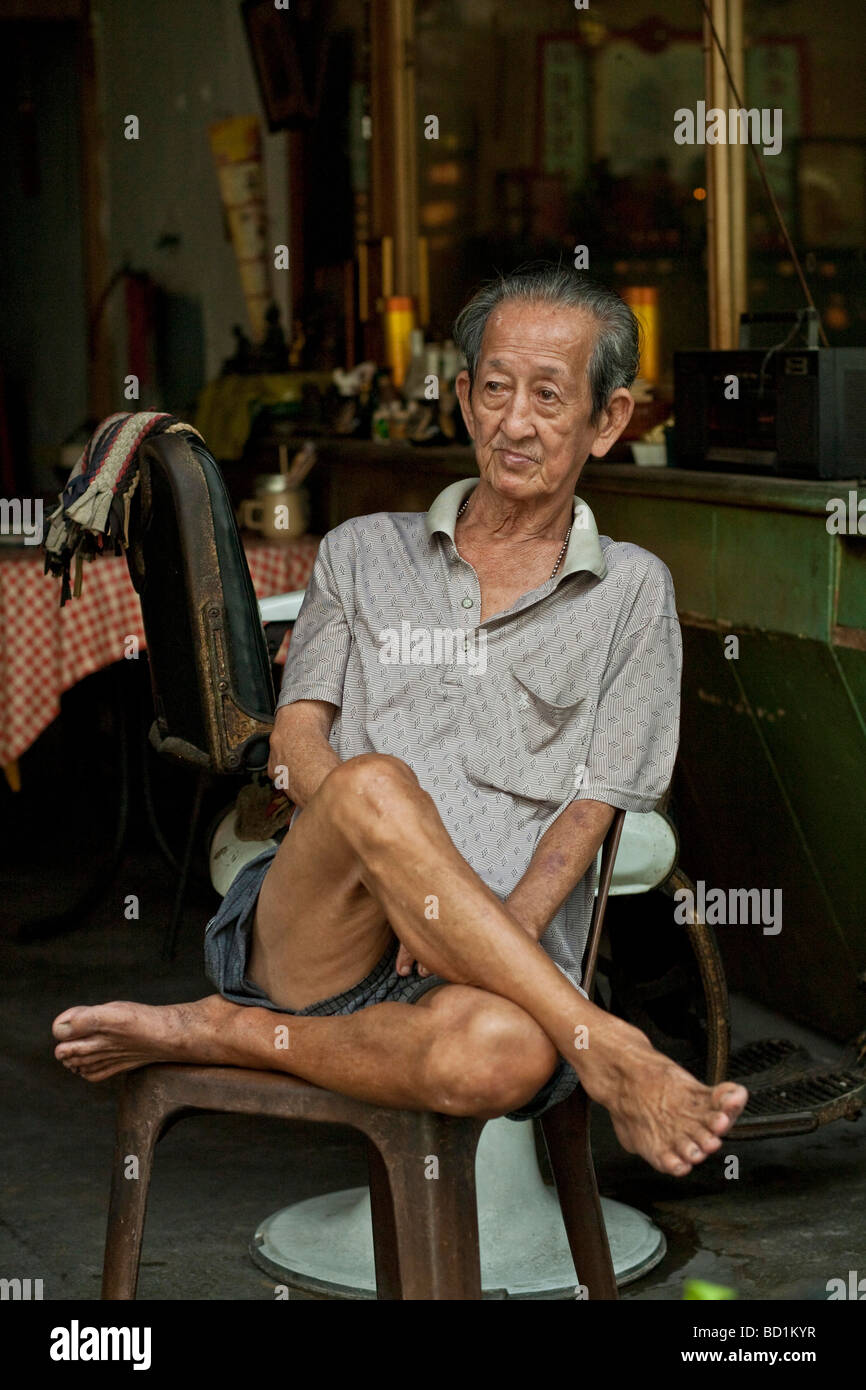 man on chair malaysia Stock Photo - Alamy