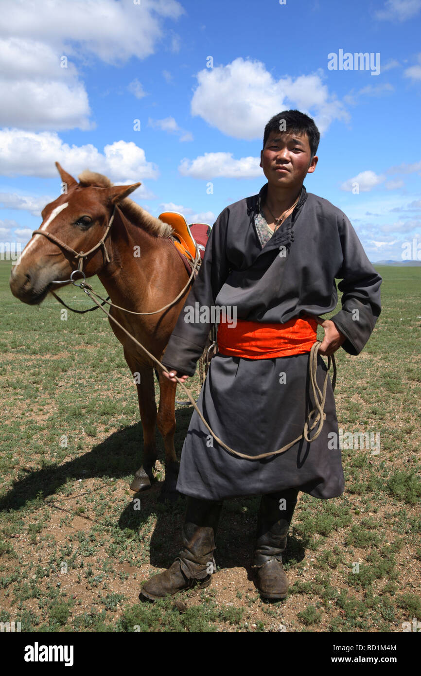Portrait of a nomadic mongol horseman with his horse, Mongolia Stock ...