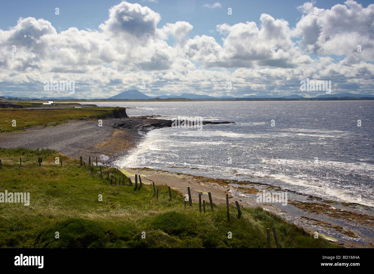 rocky shoreline near Enniscrone Co Sligo Ireland with view of Nephin ...