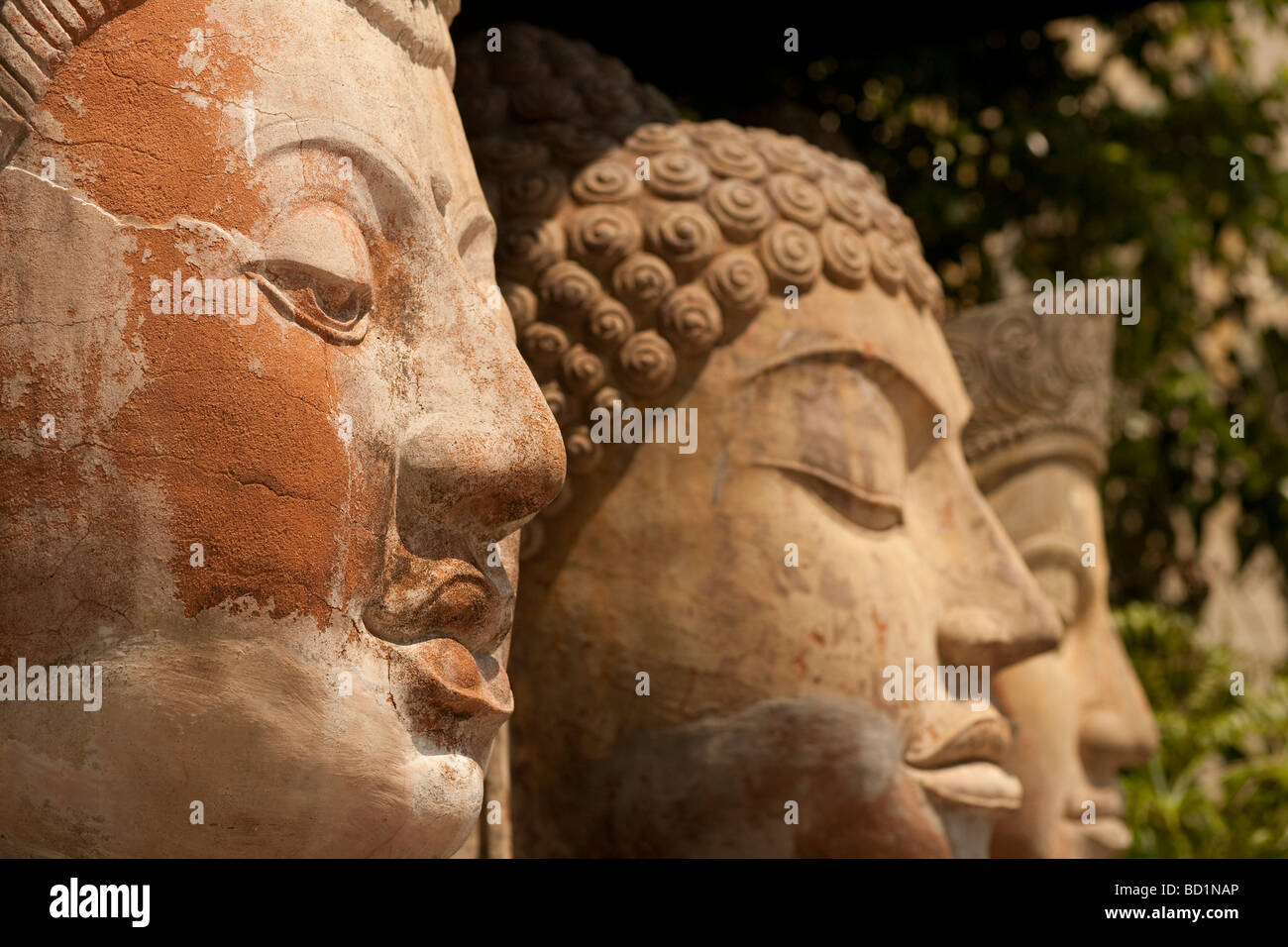Buddhist stone statues Stock Photo - Alamy