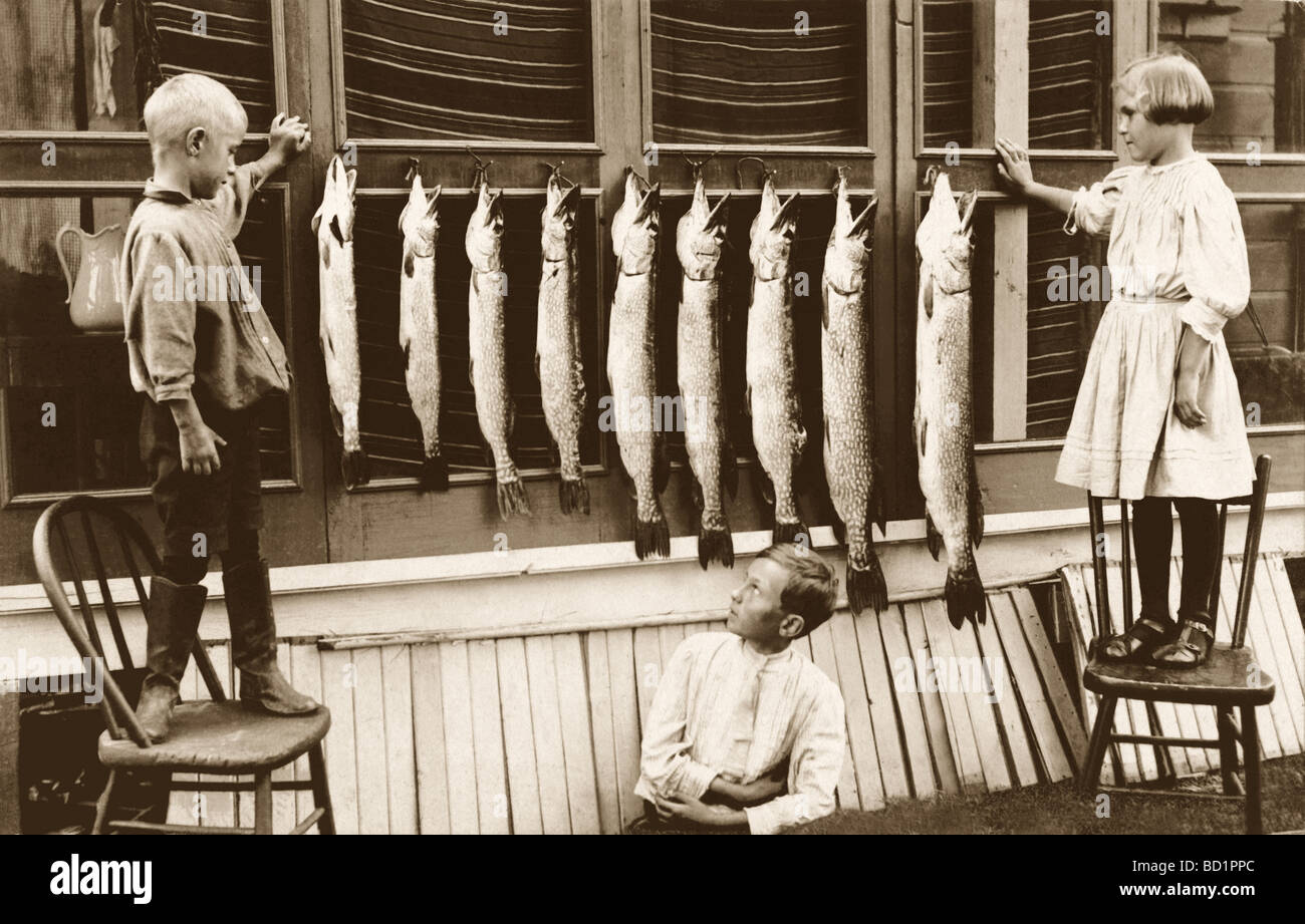 Children Displaying Fish Catch Stock Photo - Alamy