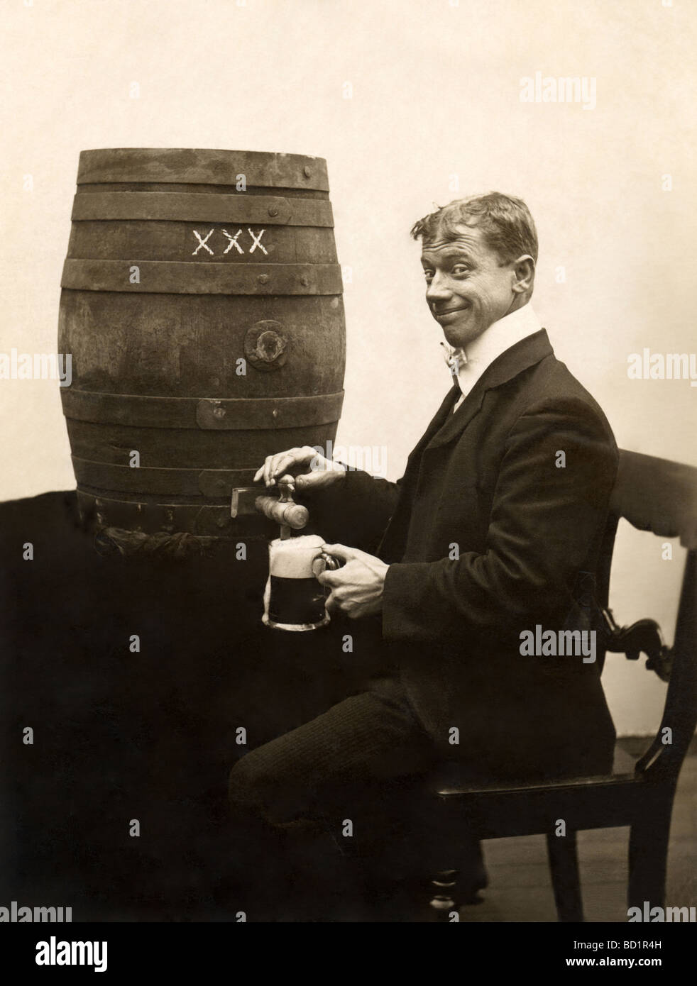 Happy Man Filling Beer Mug from Keg Stock Photo - Alamy