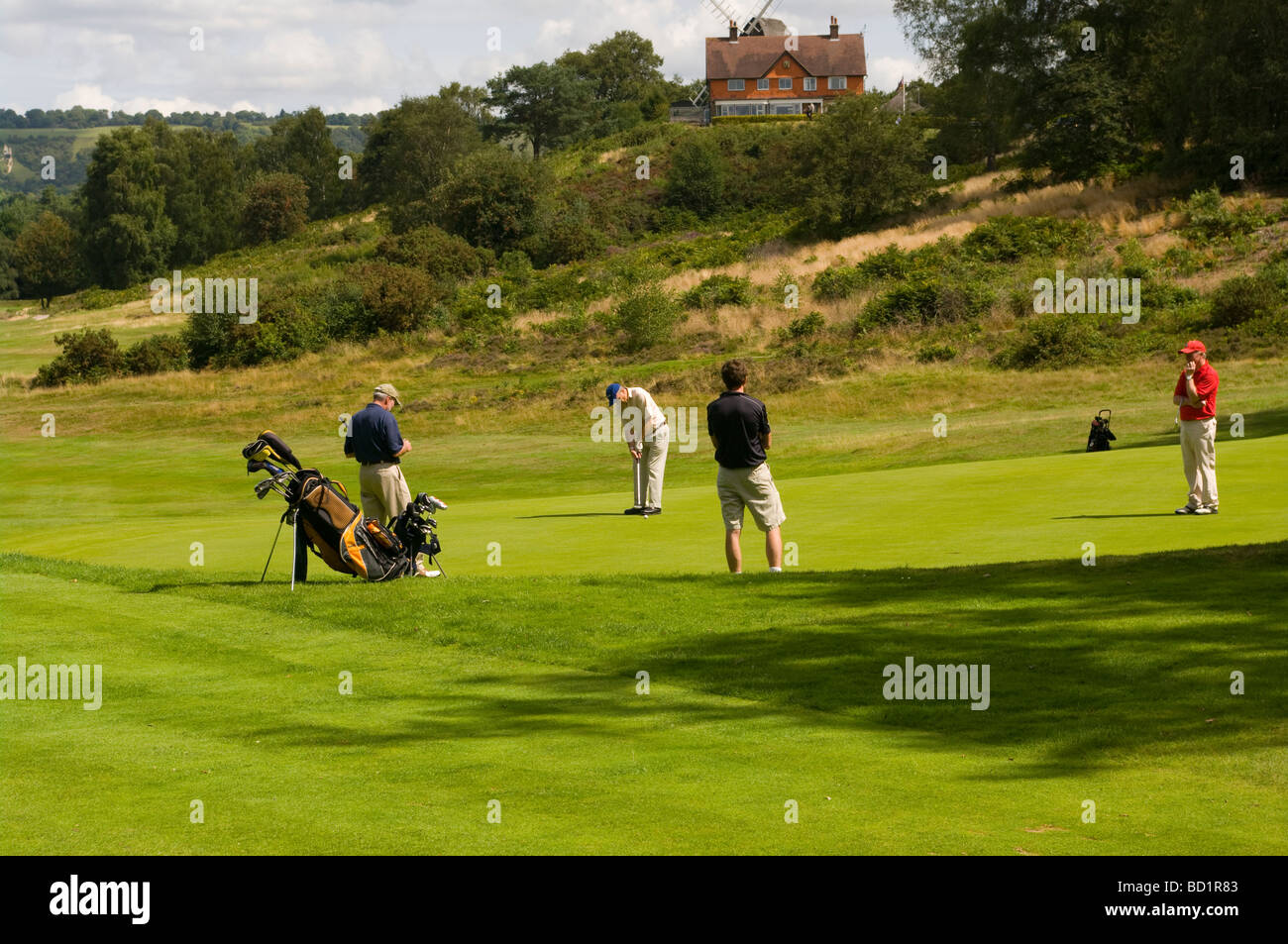 Golfers On Reigate Heath Golf Course With The Clubhouse In The ...