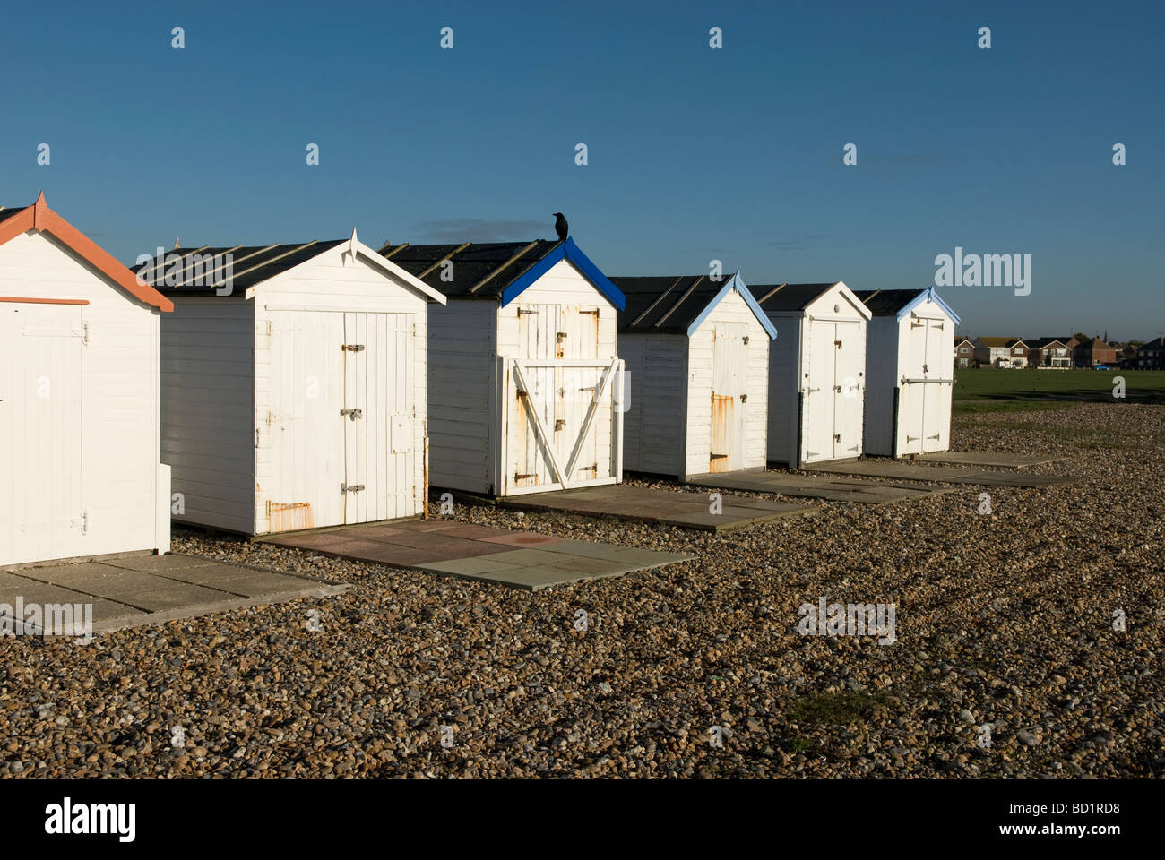 deserted beach huts at Worthing beach Stock Photo - Alamy