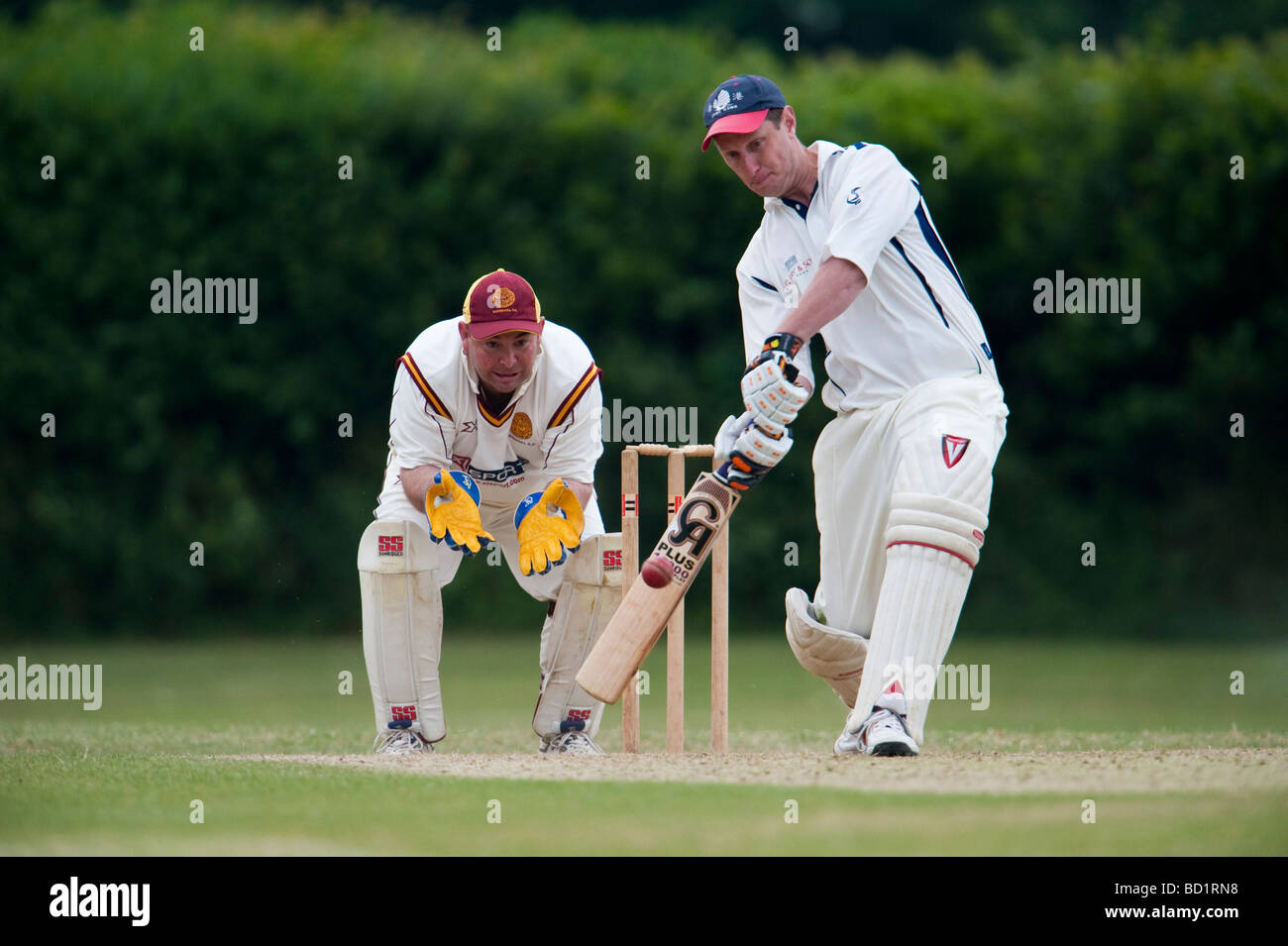 Batsman in action Stock Photo - Alamy