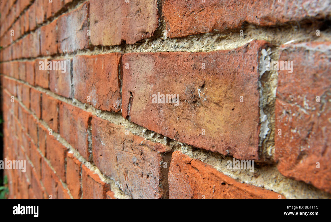 a close up of a red stone brick wall Stock Photo - Alamy