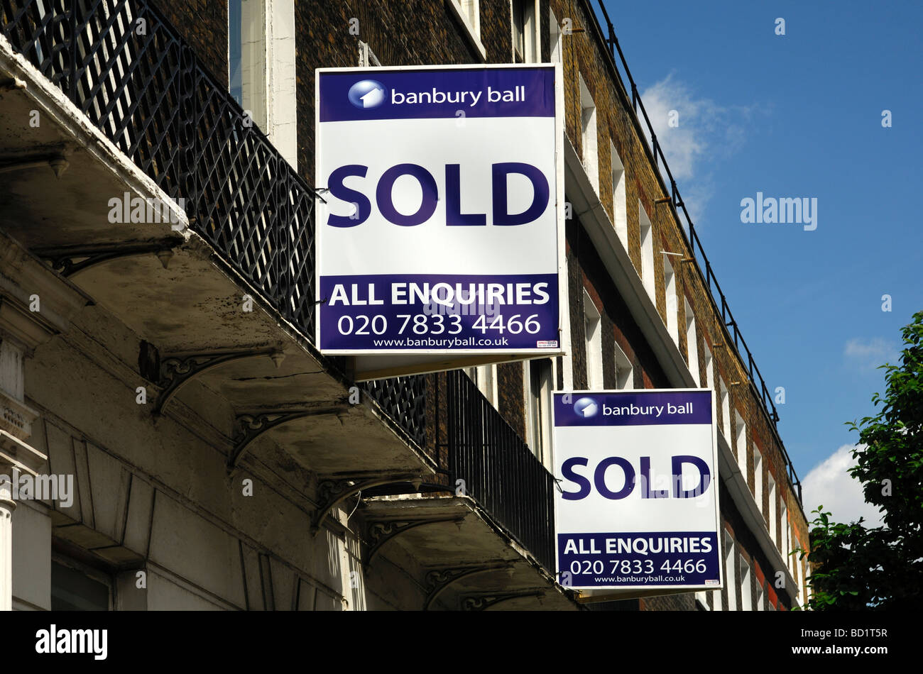 Sold signs of the Banbury Ball estate agents at a building London ...