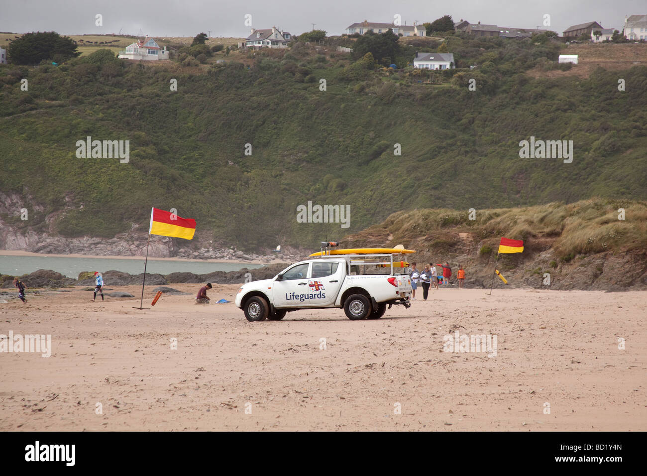 Lifeguard flags at Bantham Beech Devon England Stock Photo - Alamy