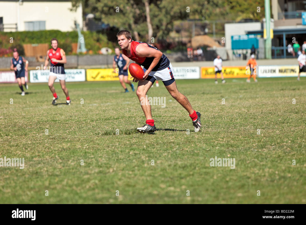 Australian Rules Football being played by two teams in a competition ...