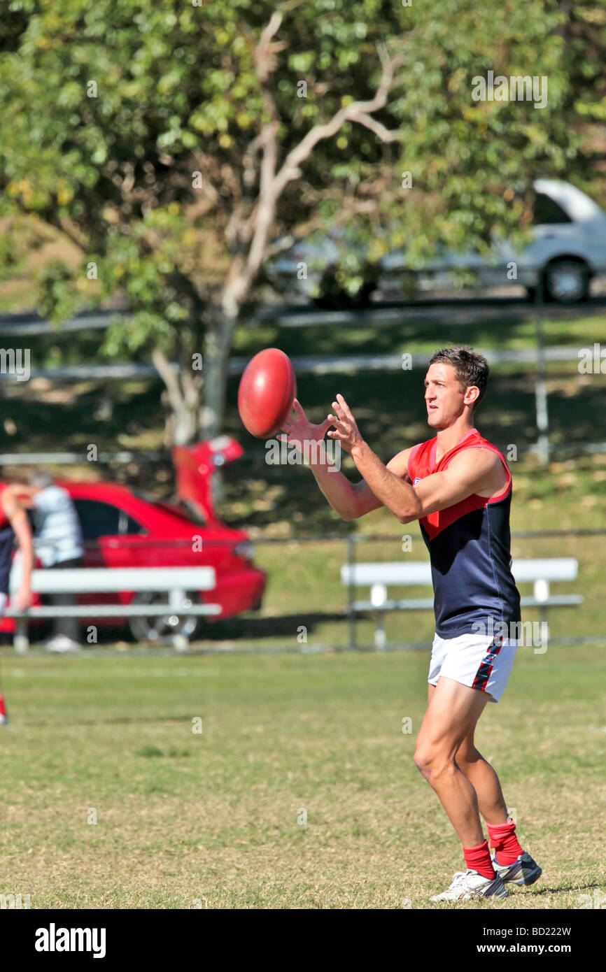 Australian Rules Football being played by two teams in a competition ...