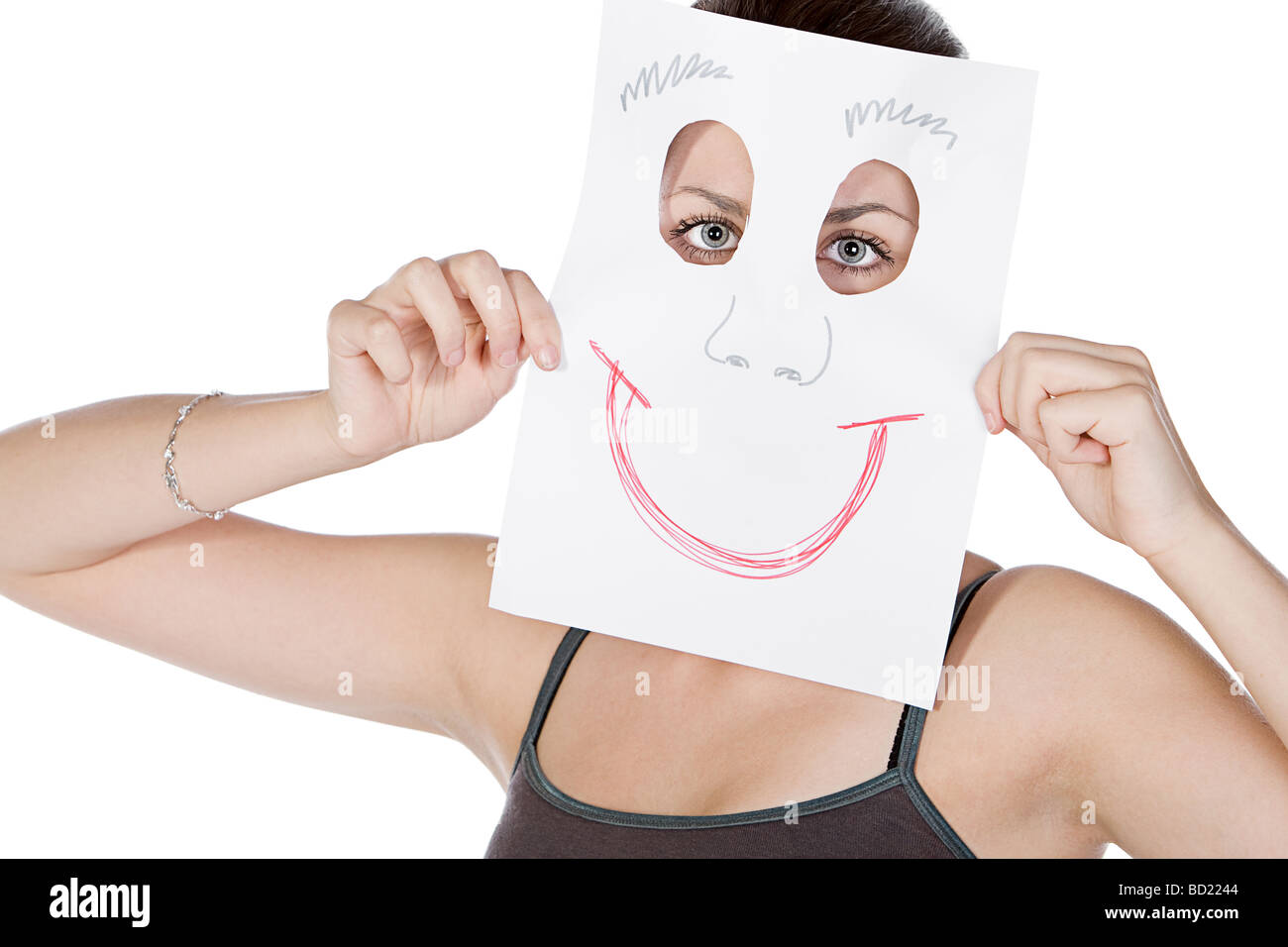Shot of a Teenager Holding Up a Cut Out Smiley Face Stock Photo - Alamy