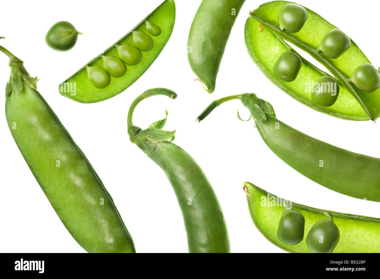 green pea pods isolated on white background Stock Photo - Alamy
