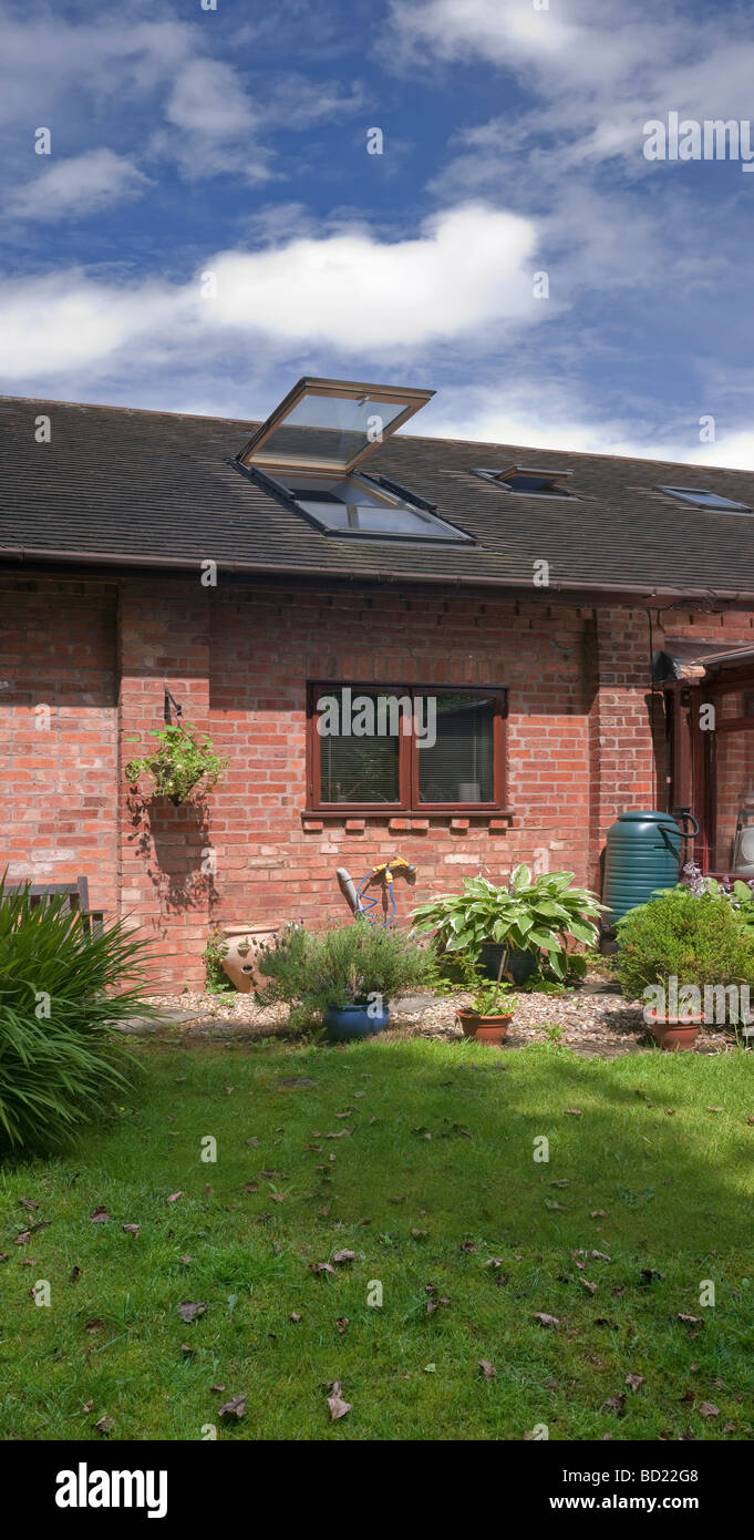 a cottage with a back garden Stock Photo - Alamy