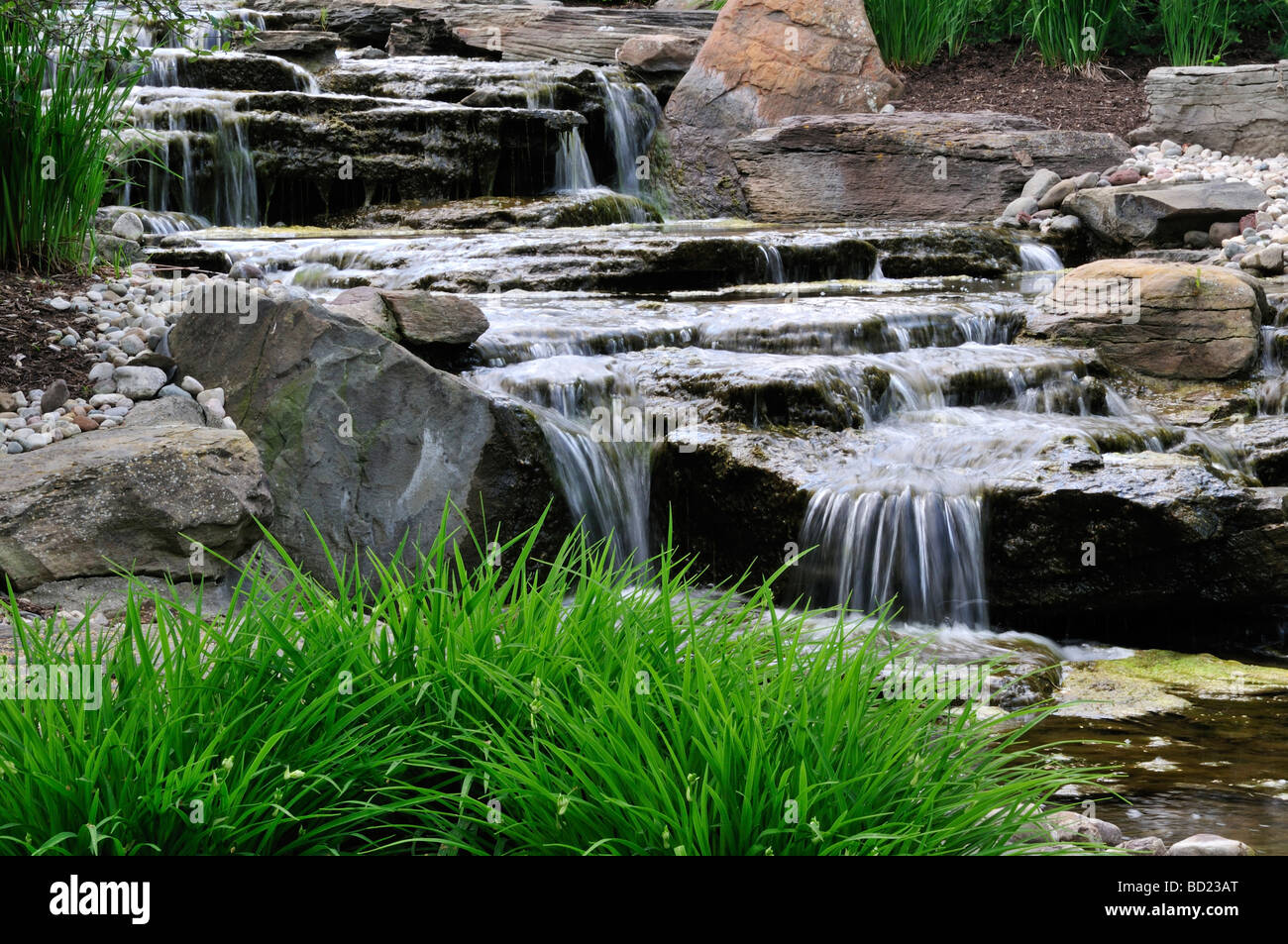 Small waterfalls water flowing over rocks Stock Photo - Alamy