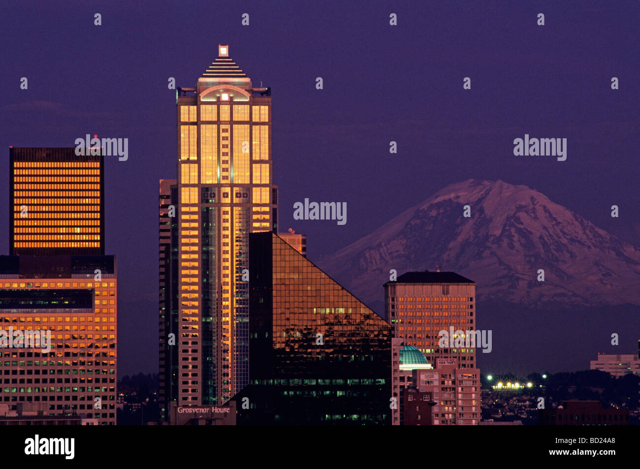 Retro image of Seattle skyline illuminated at dusk with city lights ...