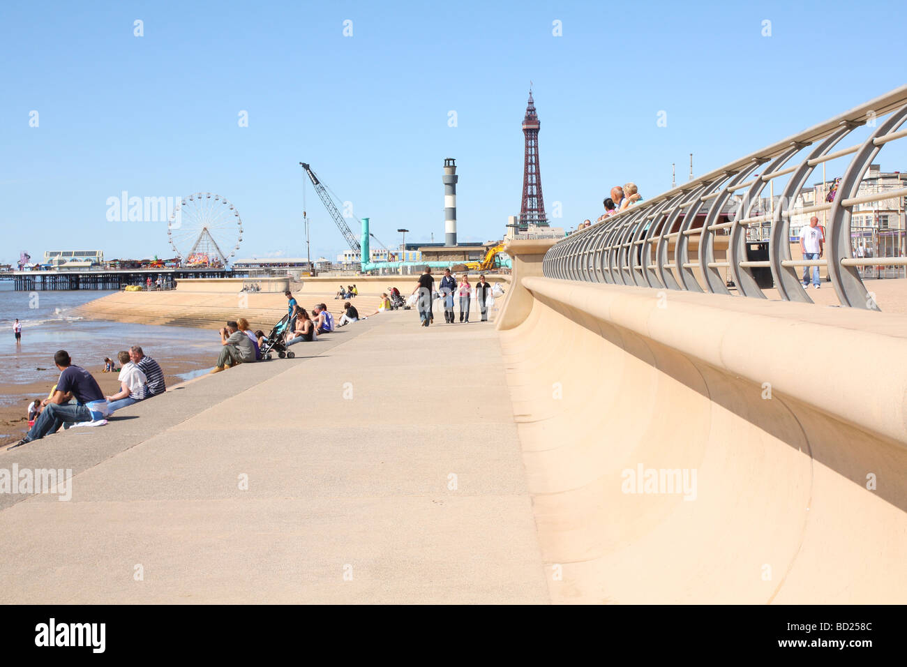 Blackpool Promenade Beach and Tower with people looking out to sea ...