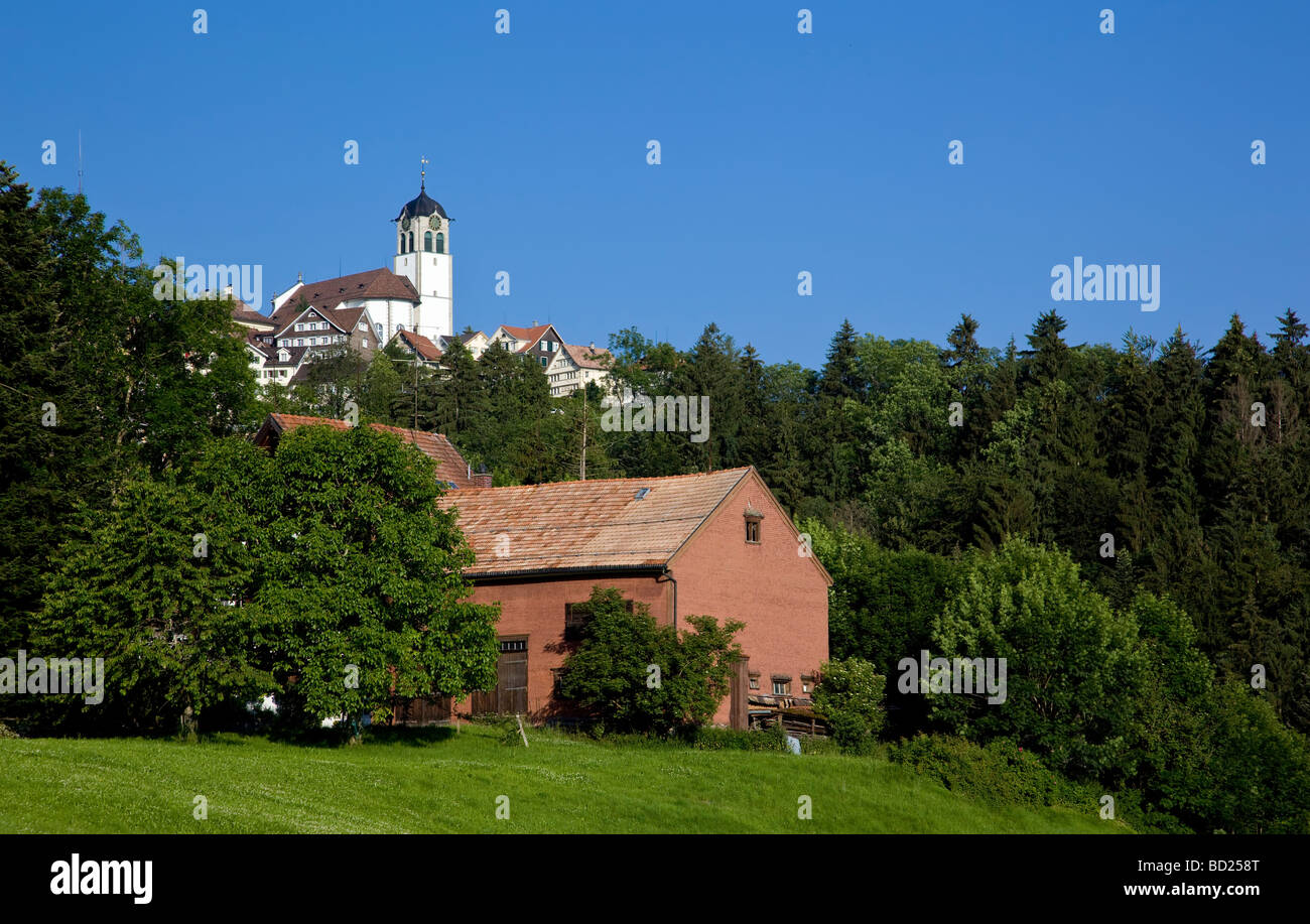 Trogen village core and church rising over a barn Appenzell Switzerland ...