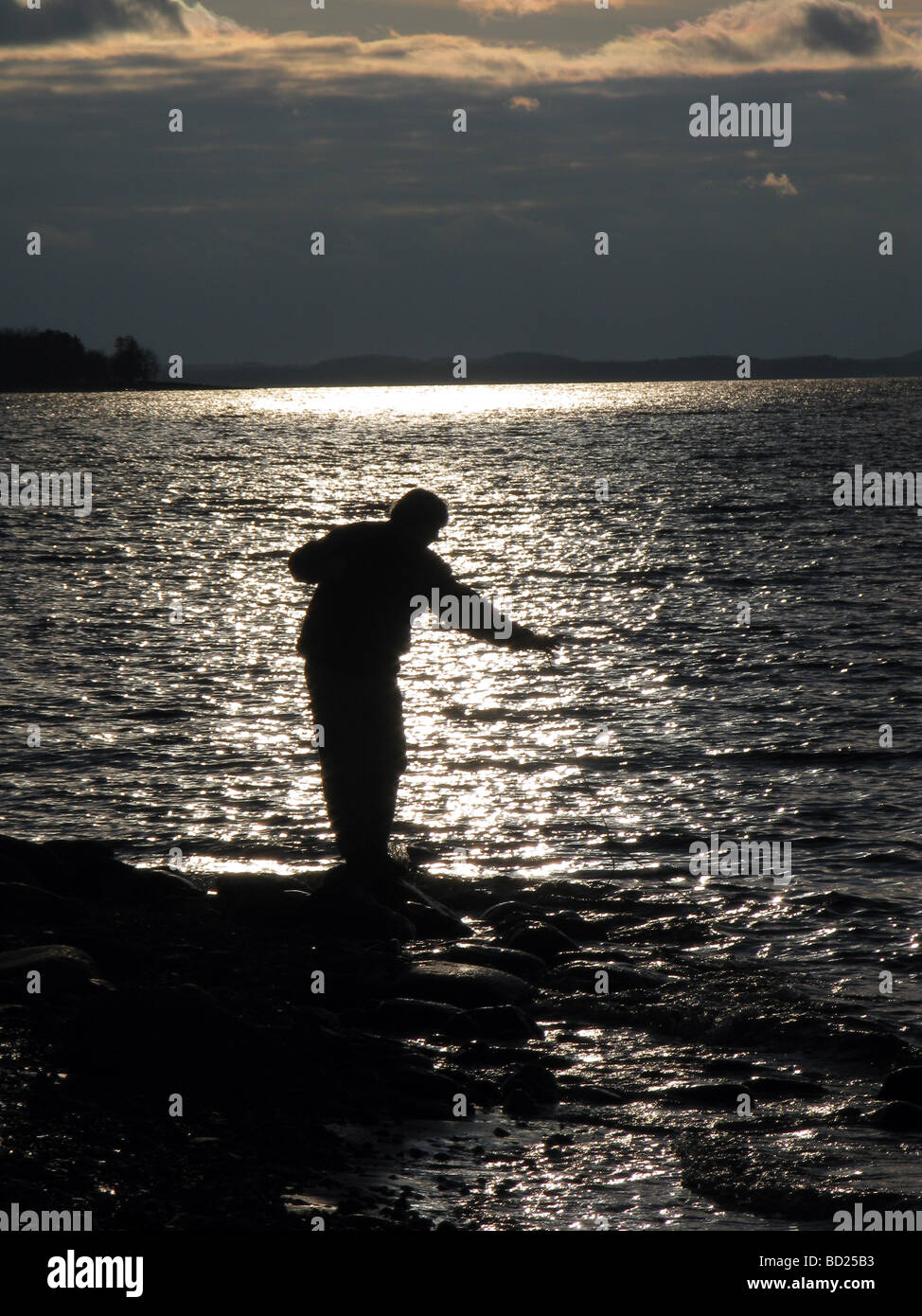 Figure on Water Stock Photo - Alamy