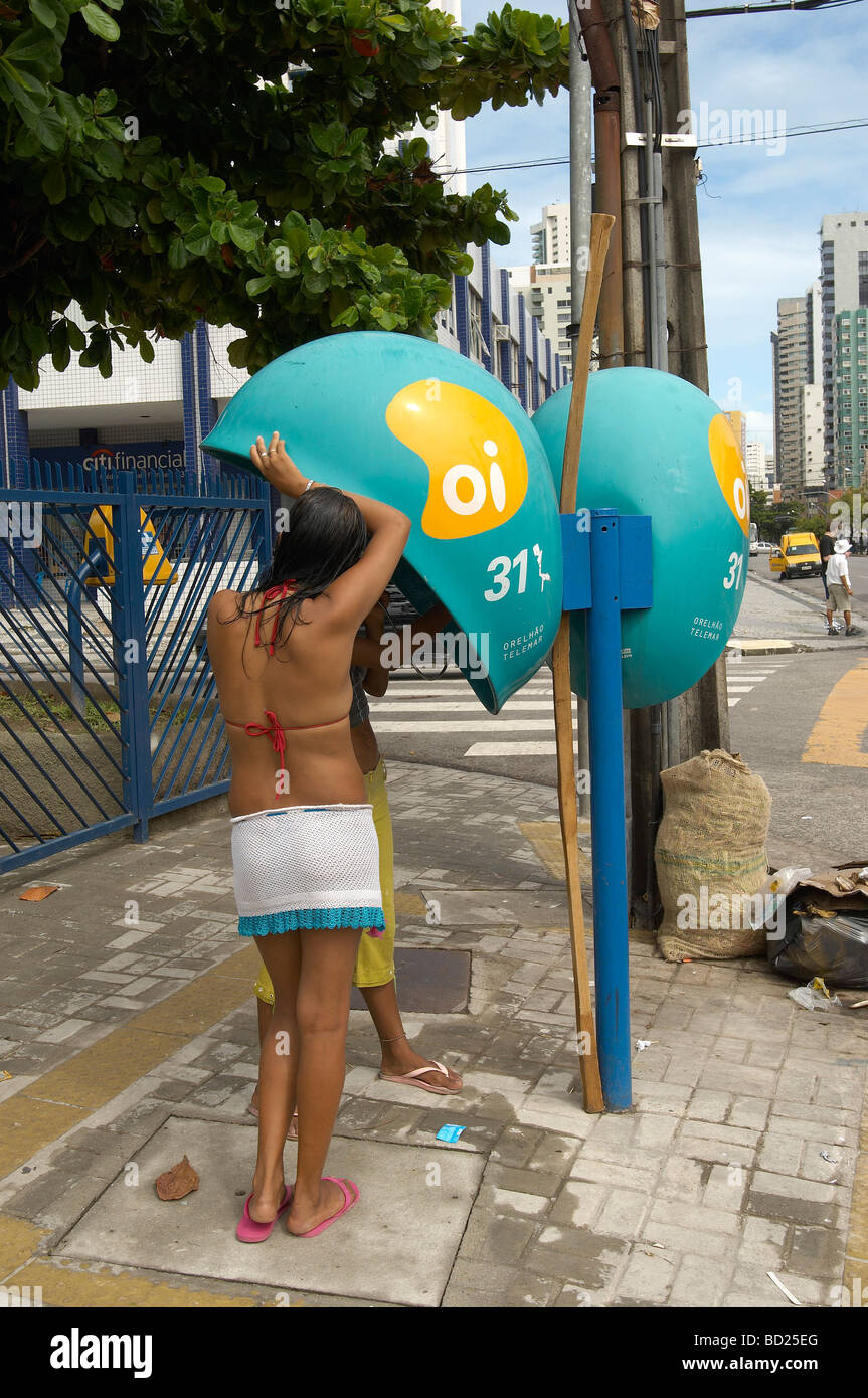 Young women at public phone box on street in brazil Stock Photo - Alamy