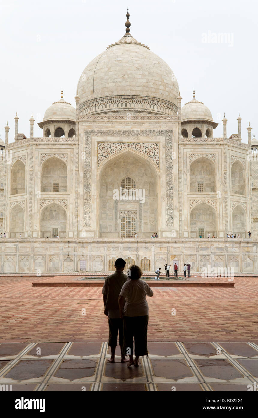 Tourist couple view the west side of the Taj Mahal from the mosque on ...