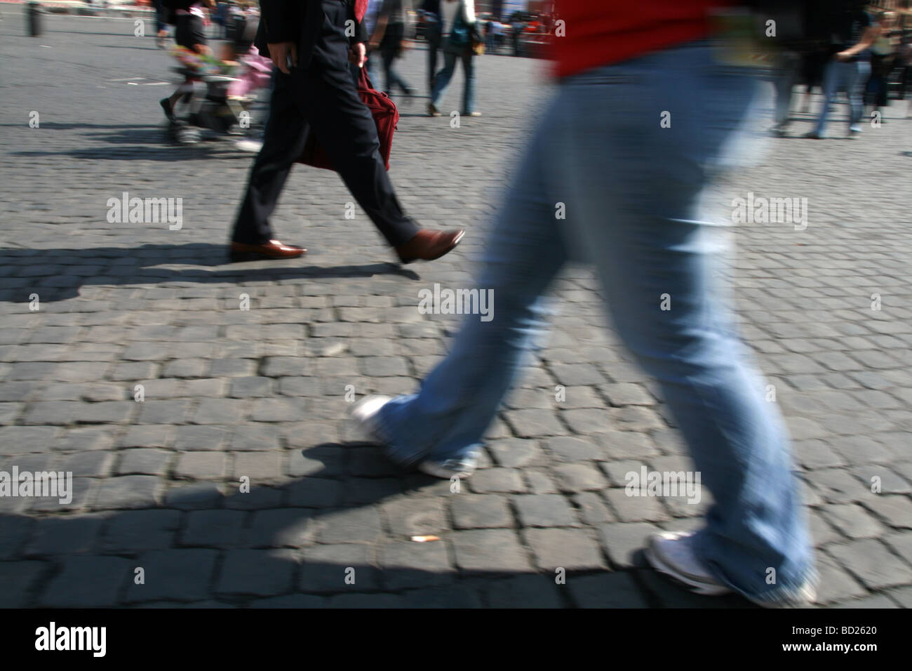 one person walking in street in city town Stock Photo - Alamy