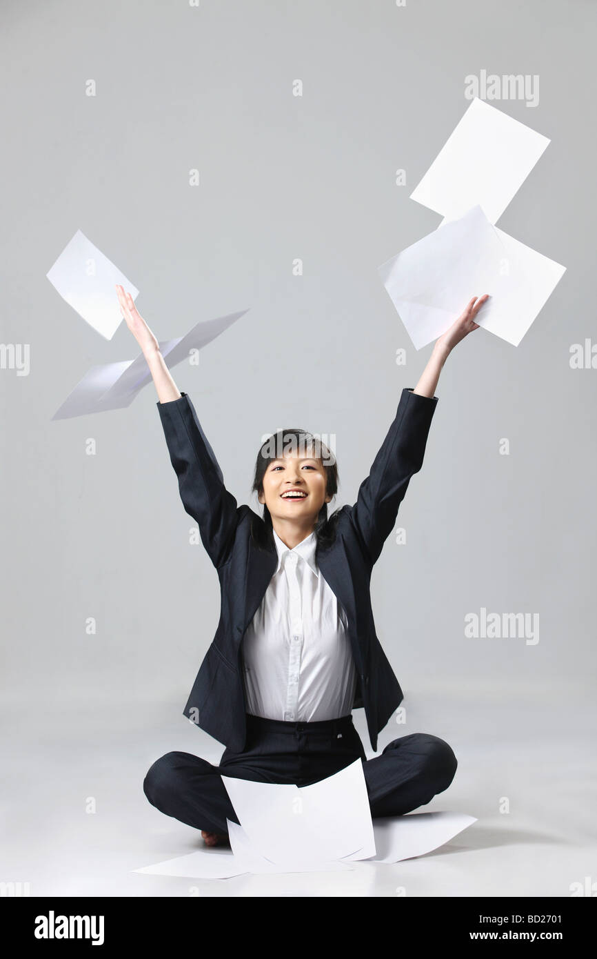 Chinese girl throwing the papers in the air,China Stock Photo - Alamy