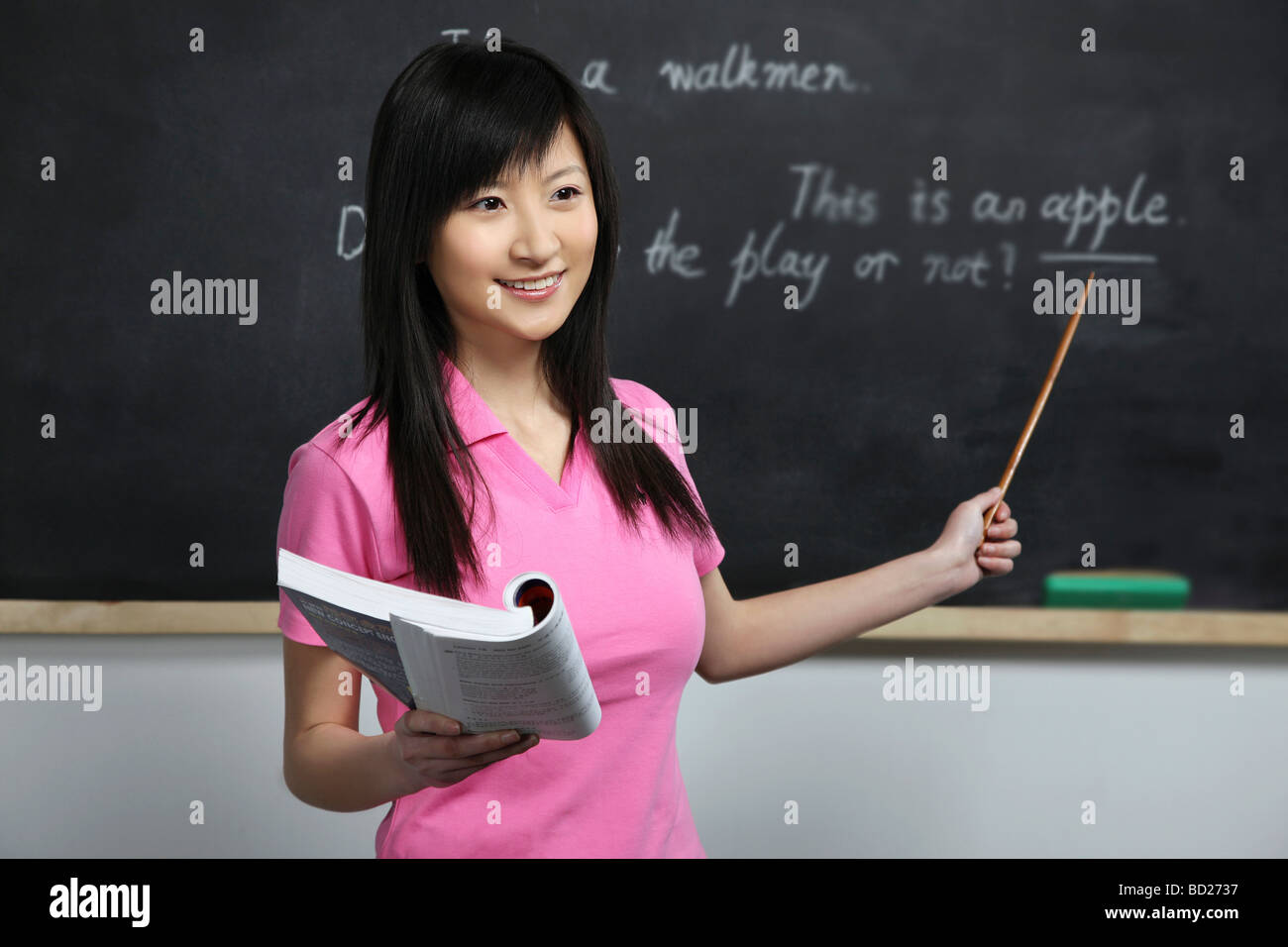 Chinese young teacher on the lesson,China Stock Photo - Alamy