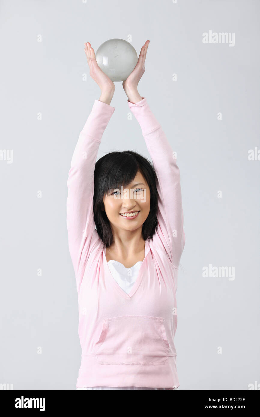 Chinese girl holding crystal ball,China Stock Photo - Alamy